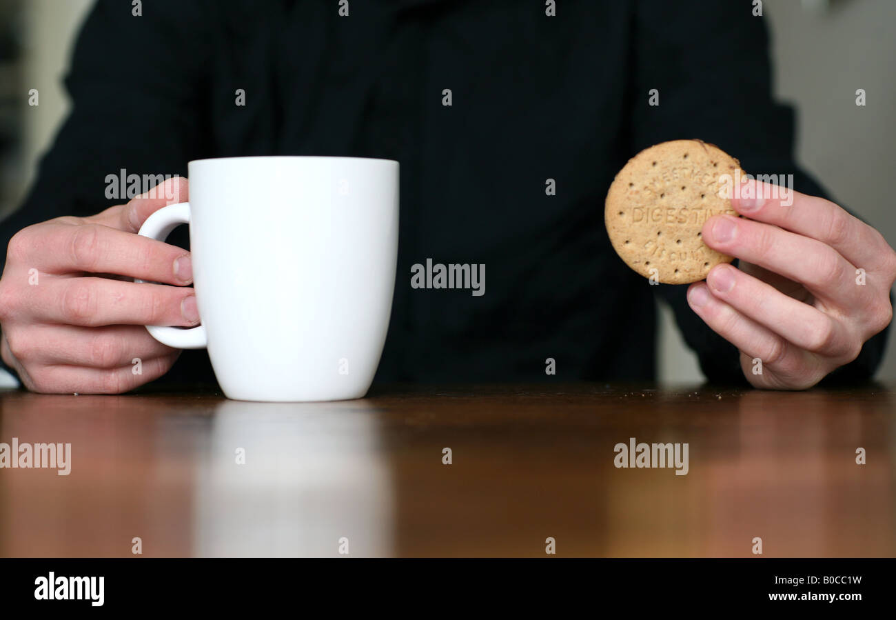 Woman chocolate digestive biscuit hi-res stock photography and images ...