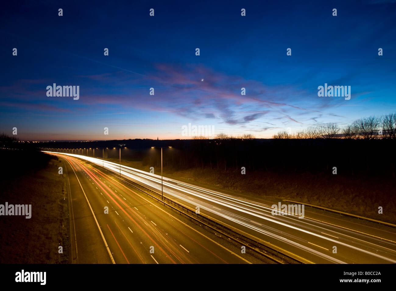 Motorway at night dusk Stock Photo - Alamy