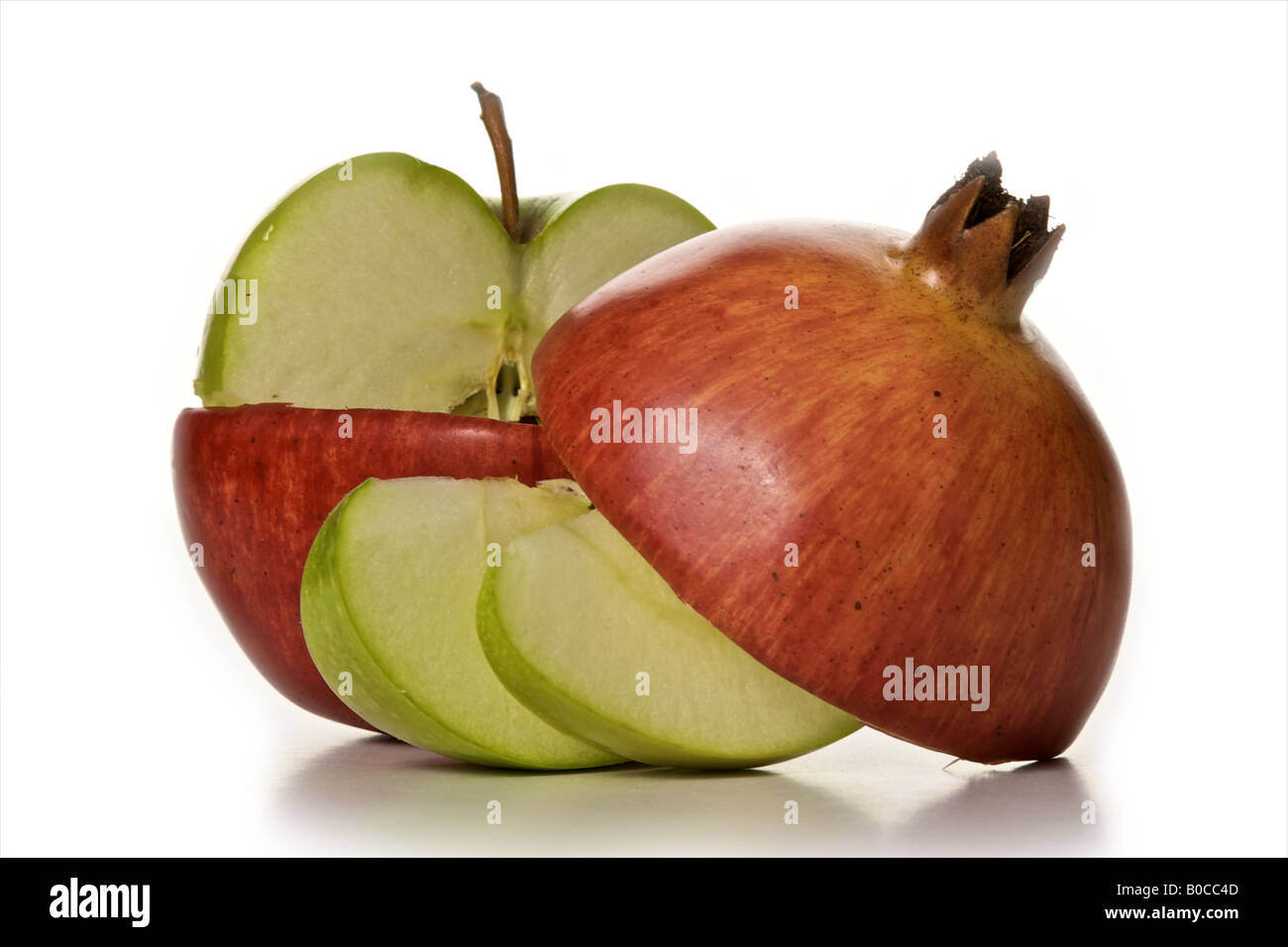 Green apple inside a pomegranate Stock Photo - Alamy