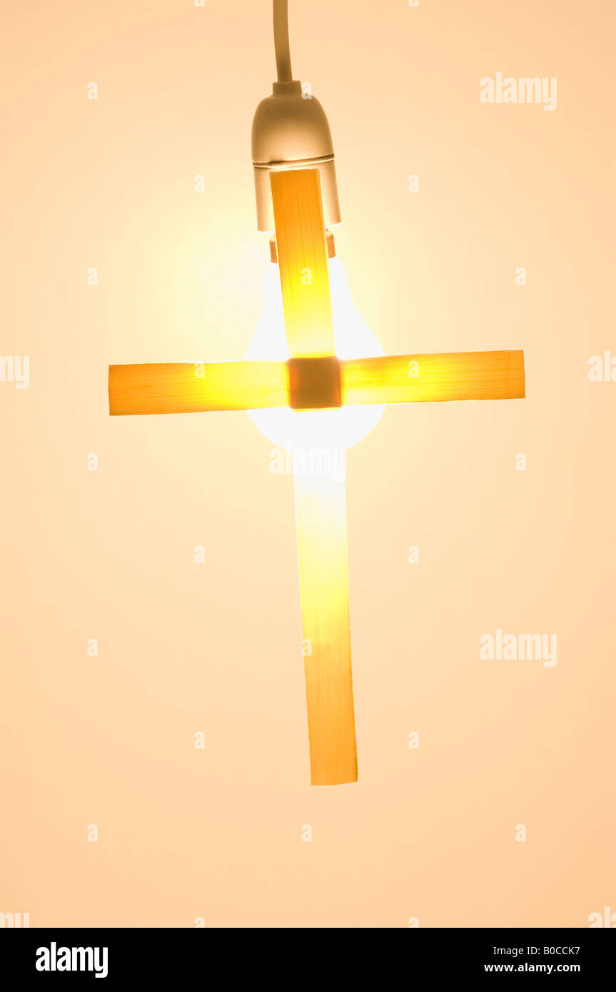 Cross on illuminated electric light Stock Photo - Alamy