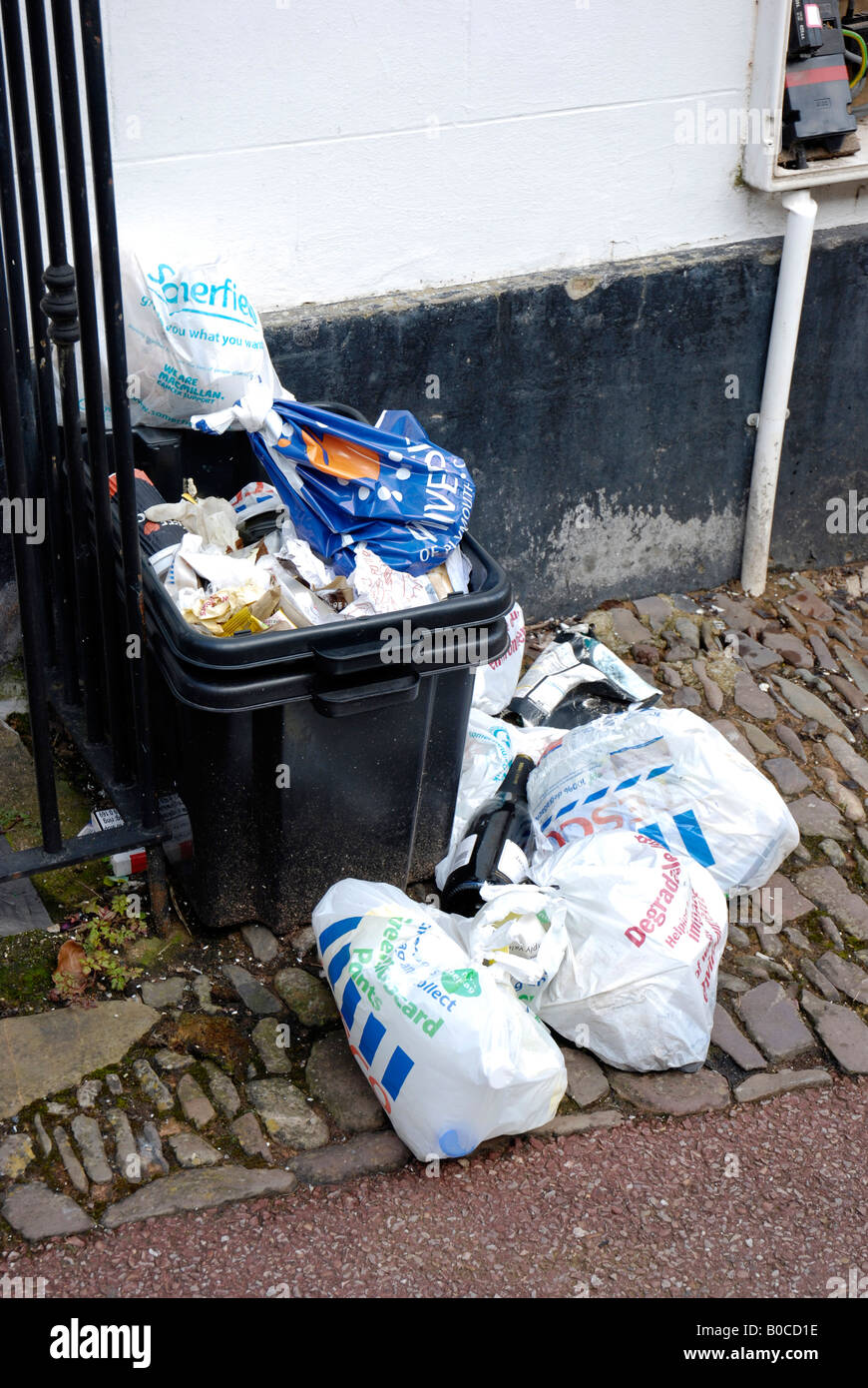 Domestic waste on the street outside a property Stock Photo - Alamy