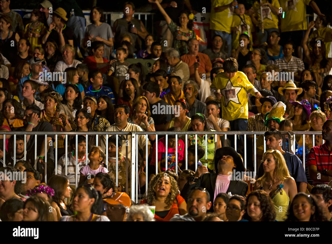 Parade crowd at night. San Antonio Texas Fiesta parade Stock Photo - Alamy