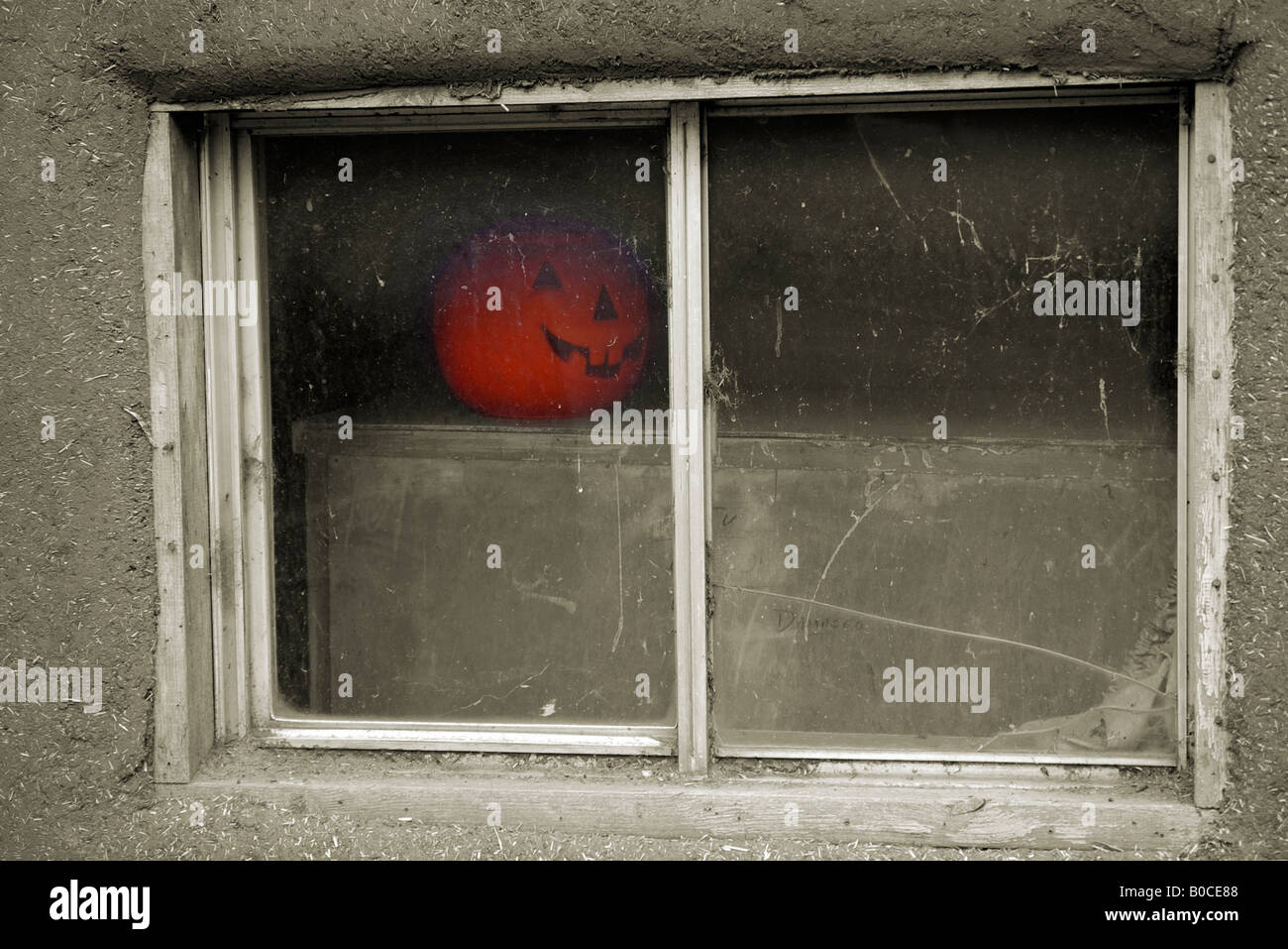 Halloween pumpkin in a window Stock Photo - Alamy