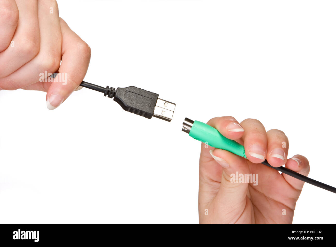 Hands trying to connect two computer cables that do not fit Stock Photo ...