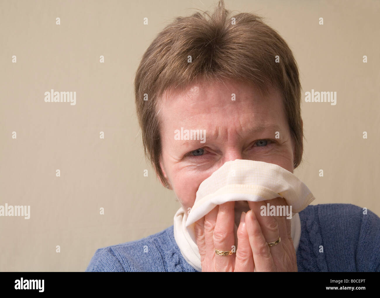 UK May Unhappy female crying into a handkerchief Stock Photo - Alamy