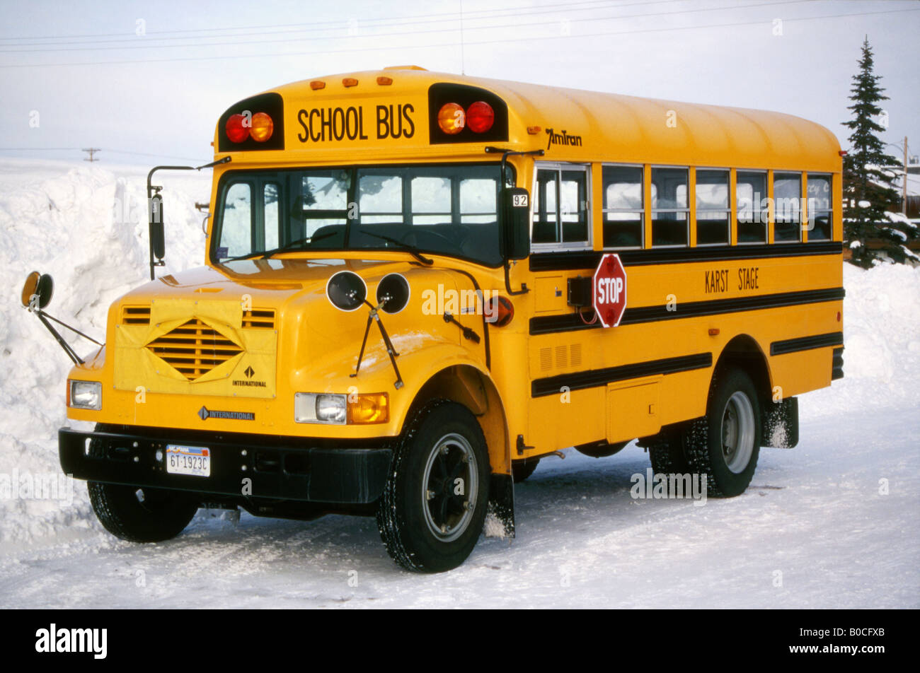 traditional american school bus standing in deep snow west yellowstone ...