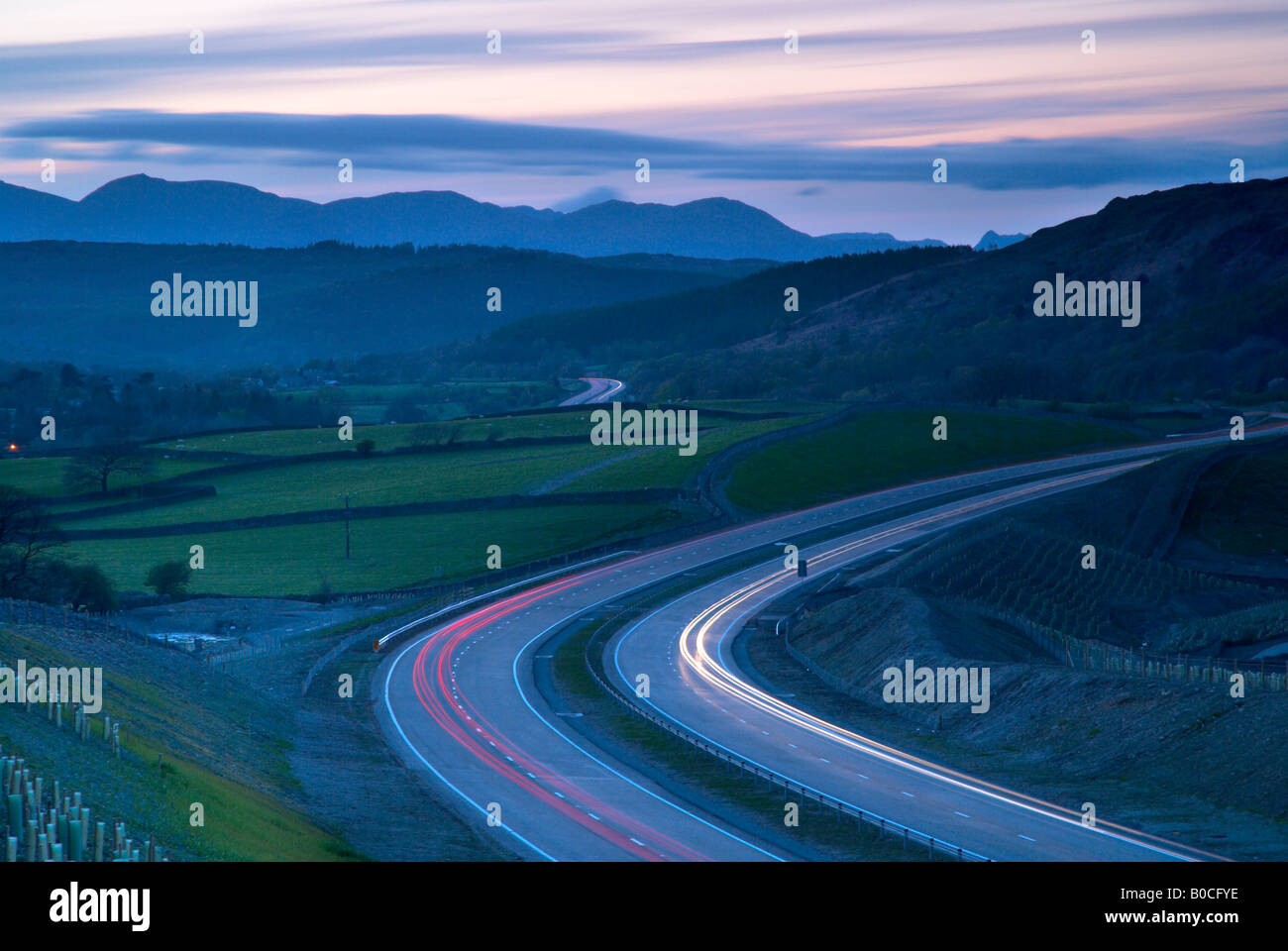 Road through the landscape at dusk The A590 High Newton By Pass on the ...