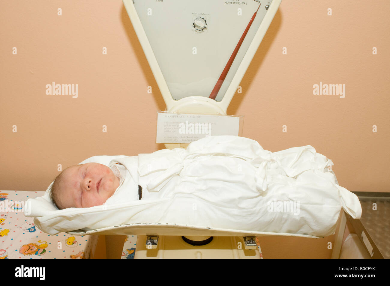 Newborn baby on Weight Scales Stock Photo - Alamy