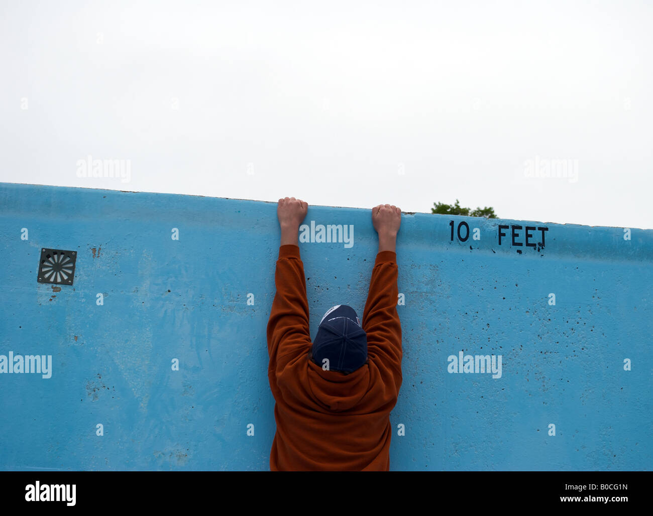 hanging of the edge Stock Photo - Alamy