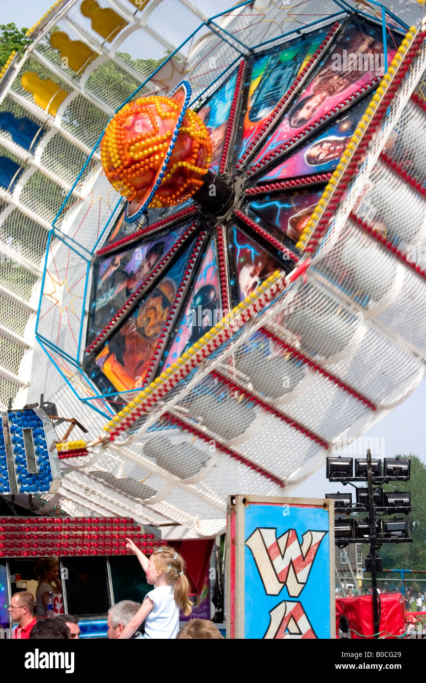 Rotating fun scary fairground ride Stock Photo - Alamy