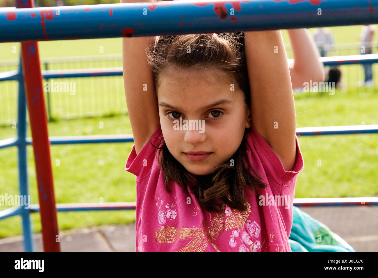 Child hanging from frame Stock Photo - Alamy