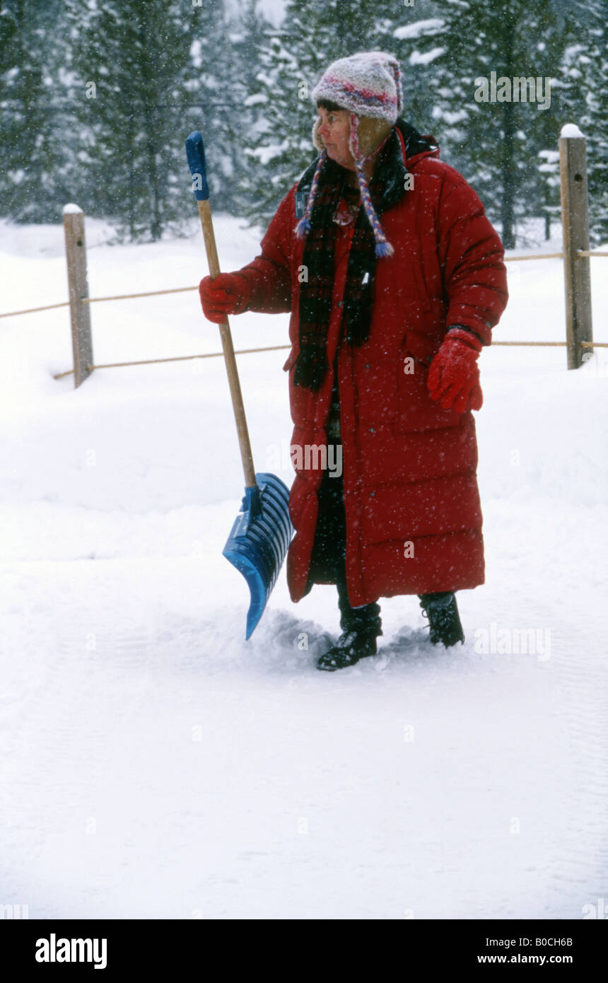Woman walking through deep snow hi-res stock photography and images - Alamy