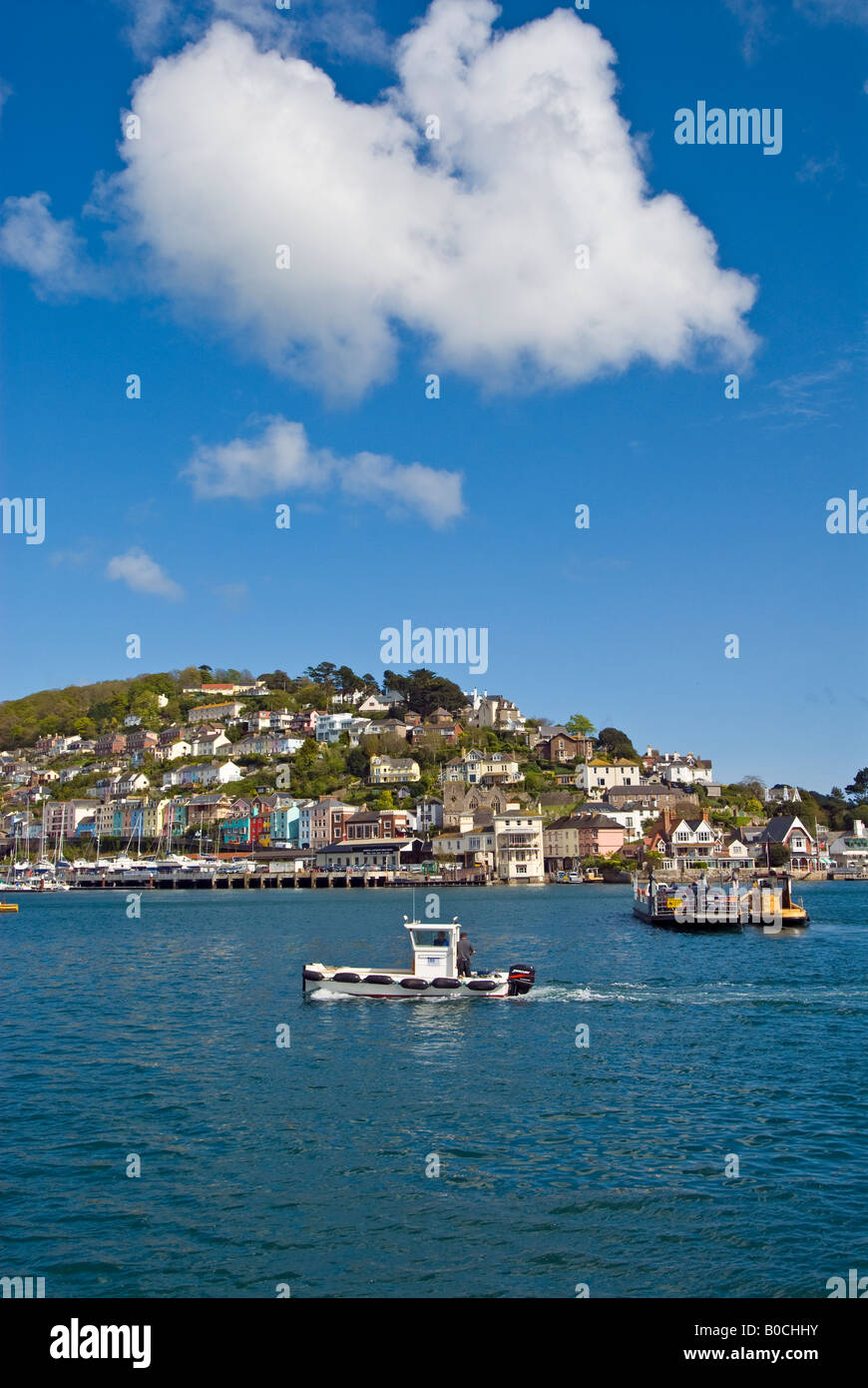 A small boat and the car ferry crossing from Dartmouth to Kingswear ...