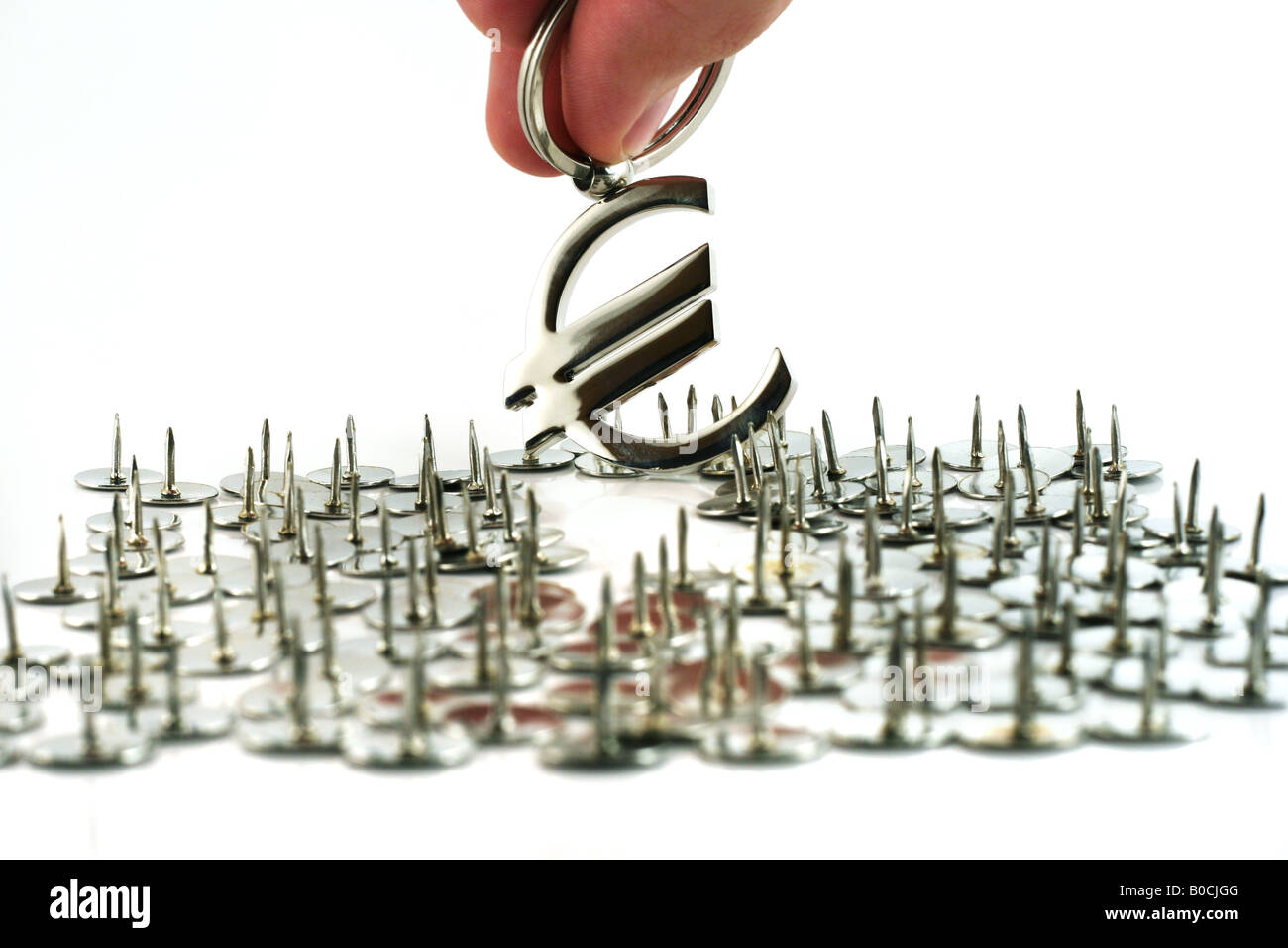 euro currency symbol on drawing pins isolated on white Stock Photo - Alamy