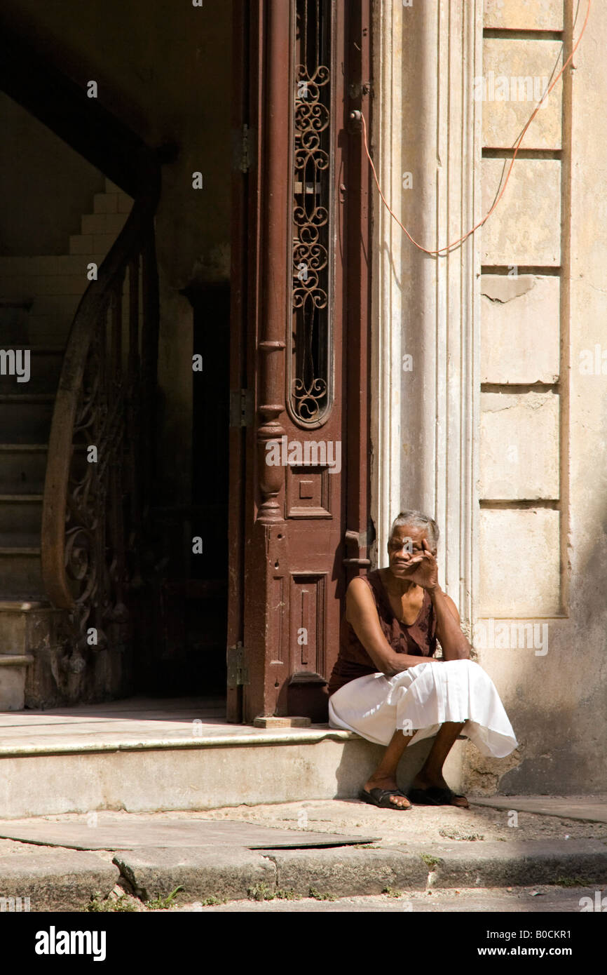 Cuban sitting on doorstep to old house hi-res stock photography and ...
