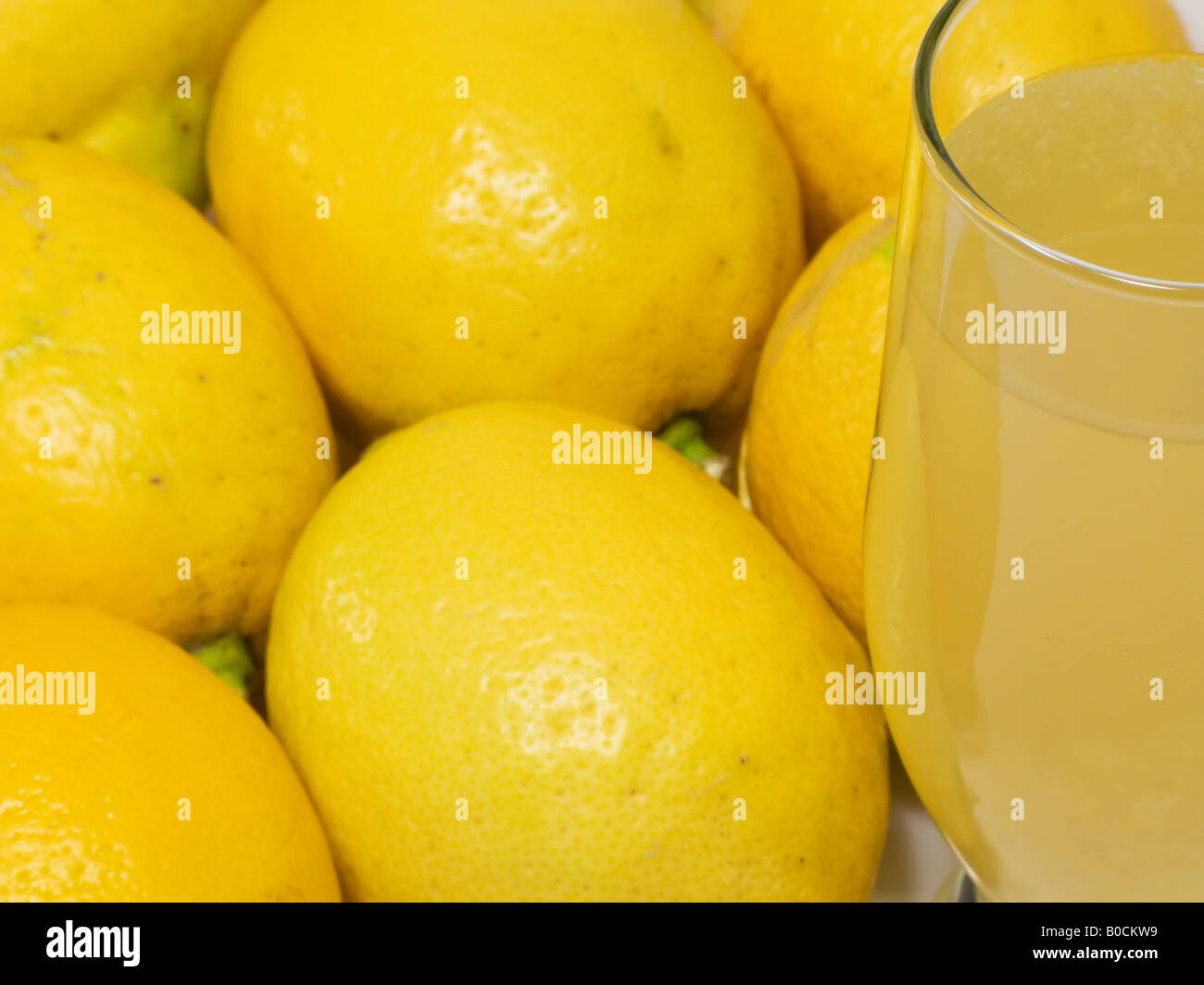 Glass of natural lemonade with several lemons Stock Photo - Alamy