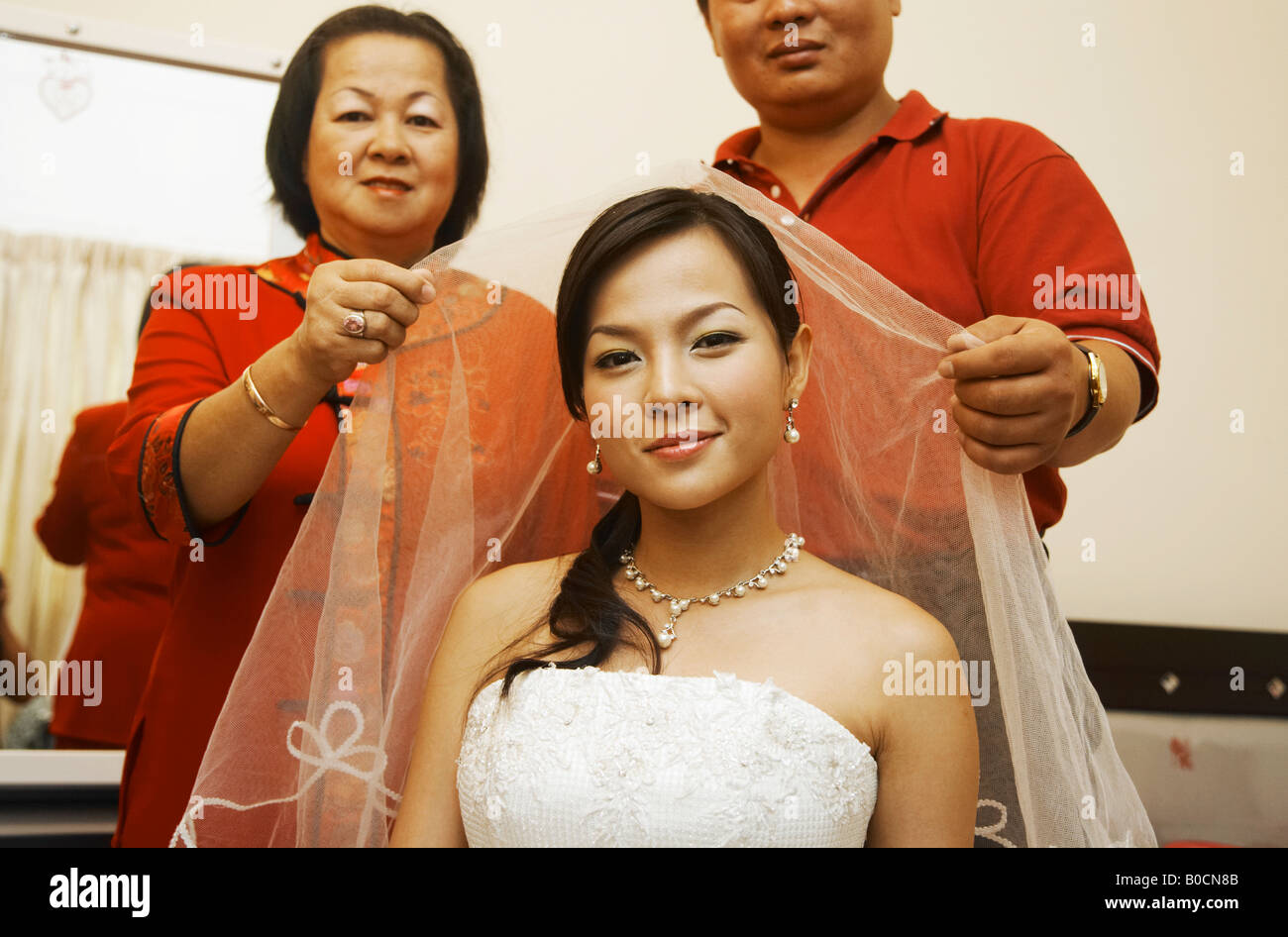 Parent blessing daughter Stock Photo - Alamy