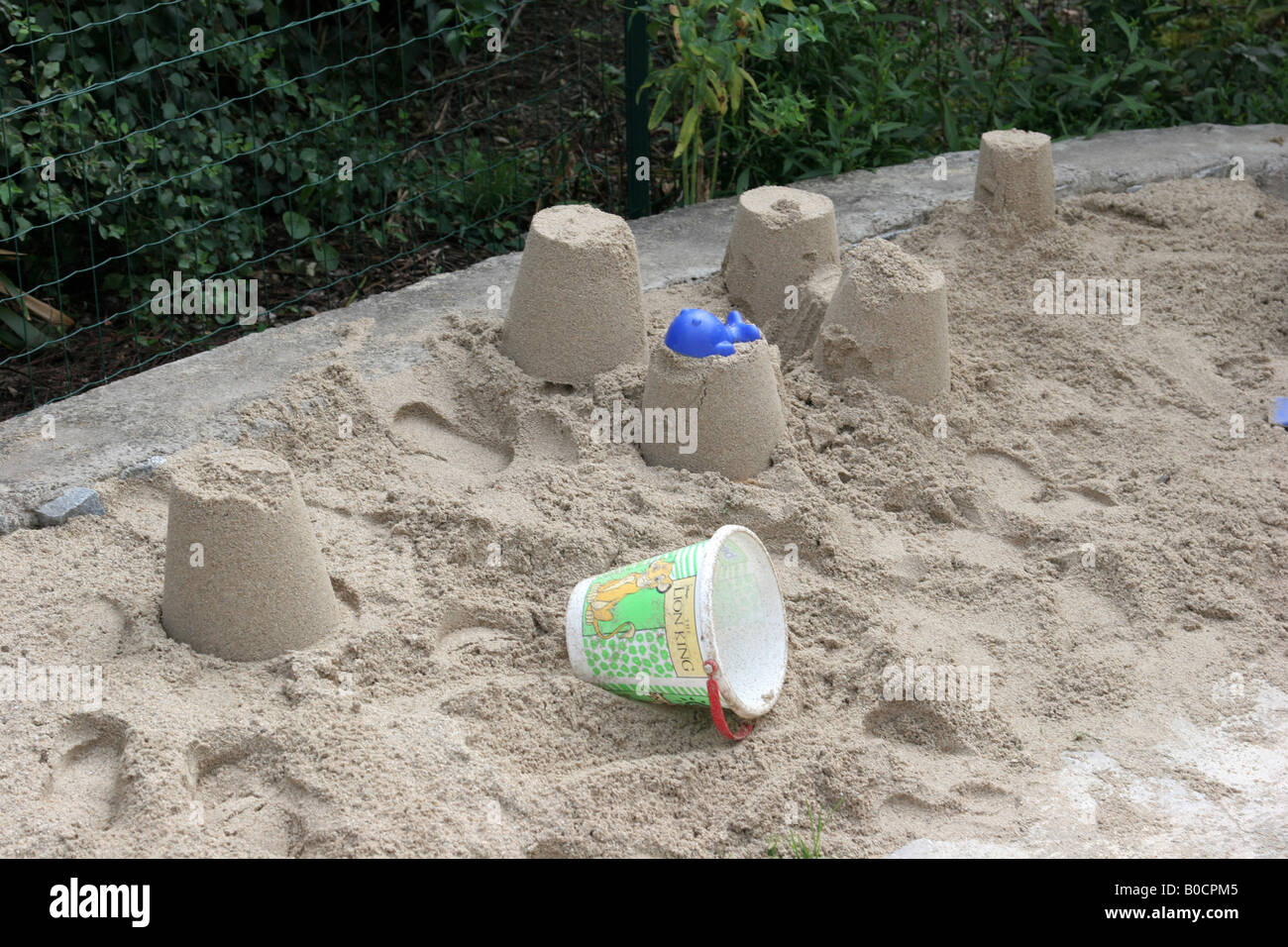 Sand castles in sand pit Stock Photo - Alamy