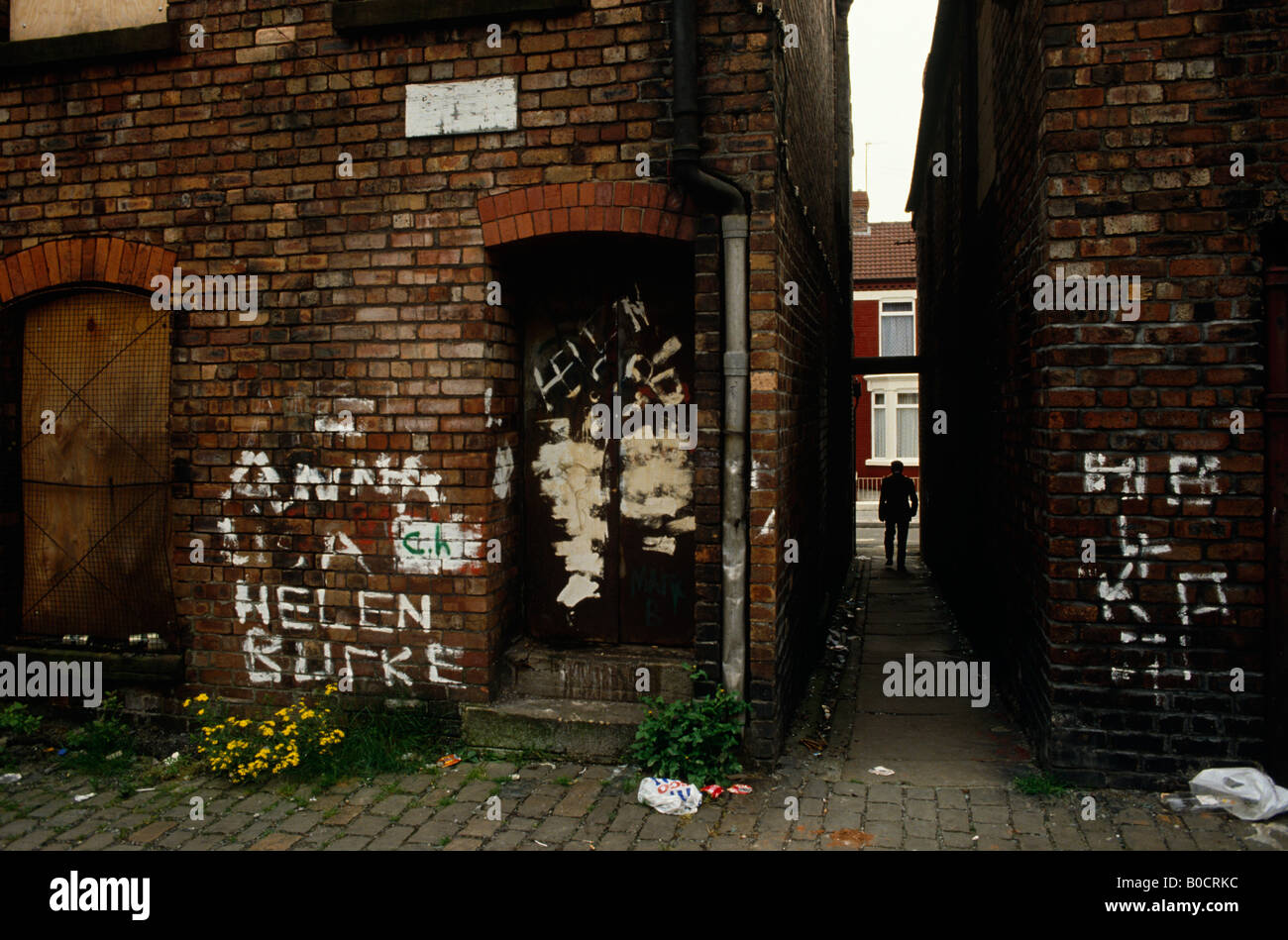 A local man walks through a filthy alleyway in Toxteth Liverpool amid ...