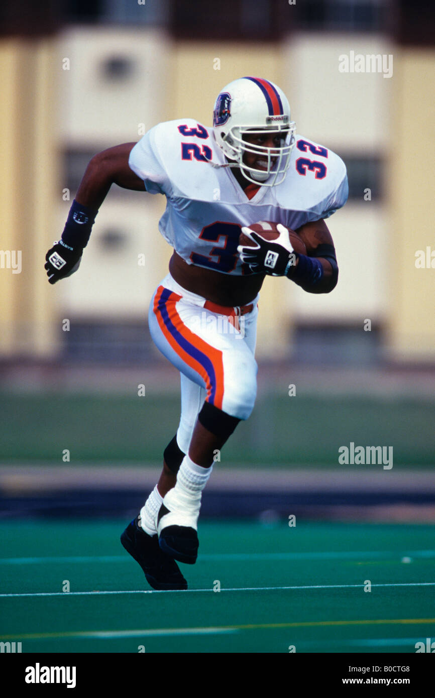 Football running back Stock Photo - Alamy