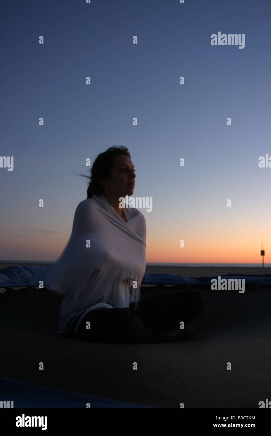 Woman gazing into the sunset Stock Photo - Alamy