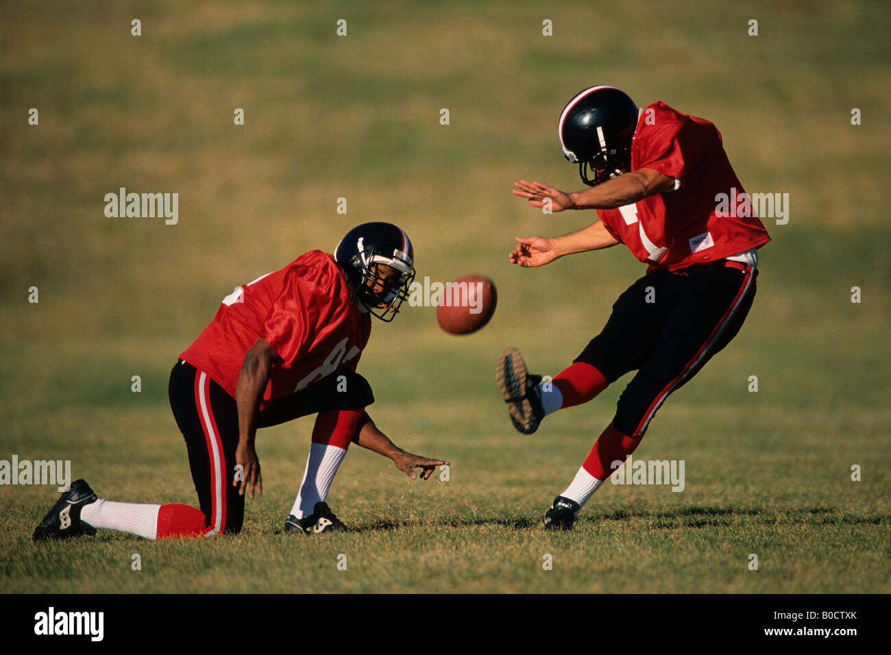 Football players in action Stock Photo - Alamy