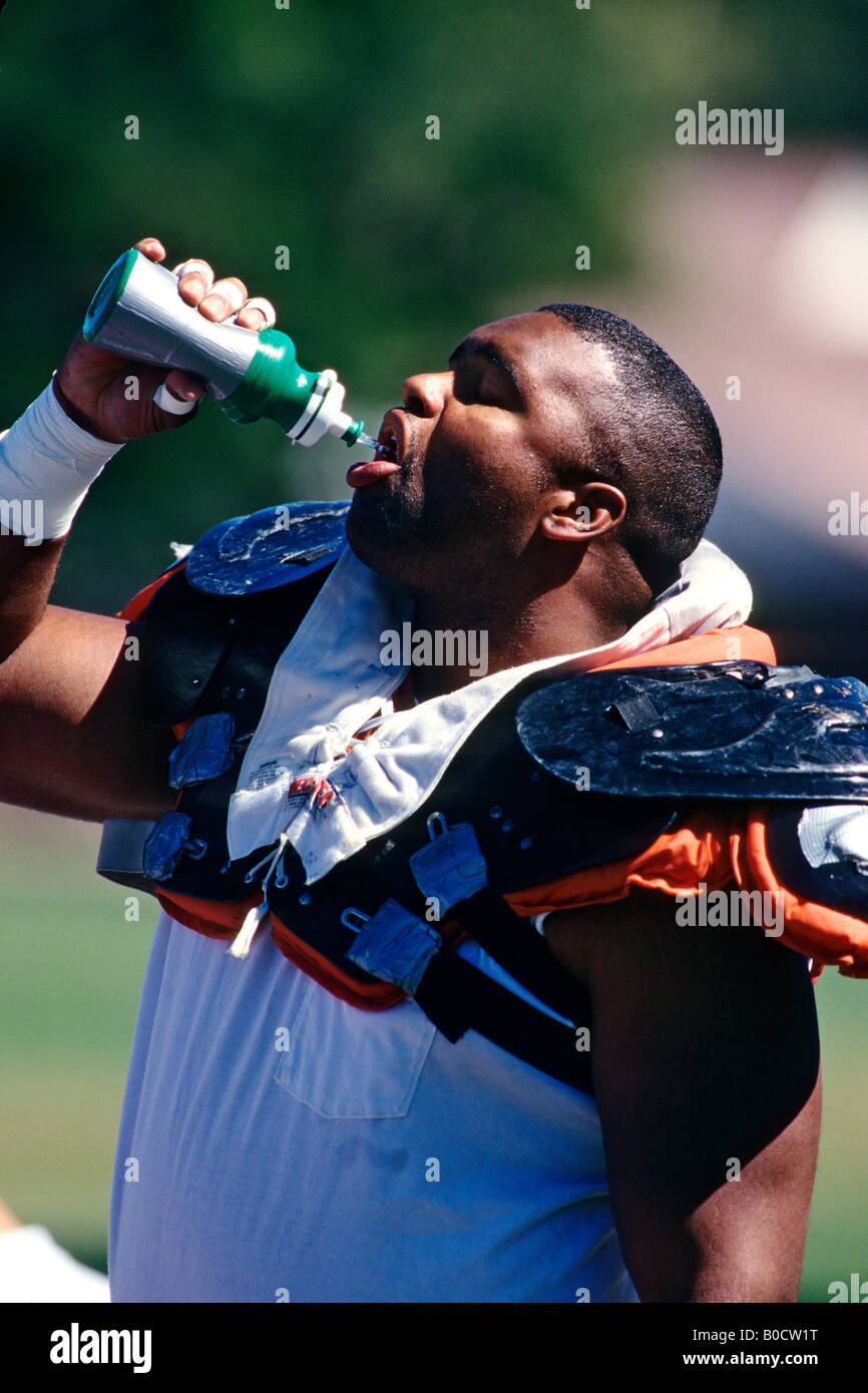 Football player drinking after workout Stock Photo - Alamy