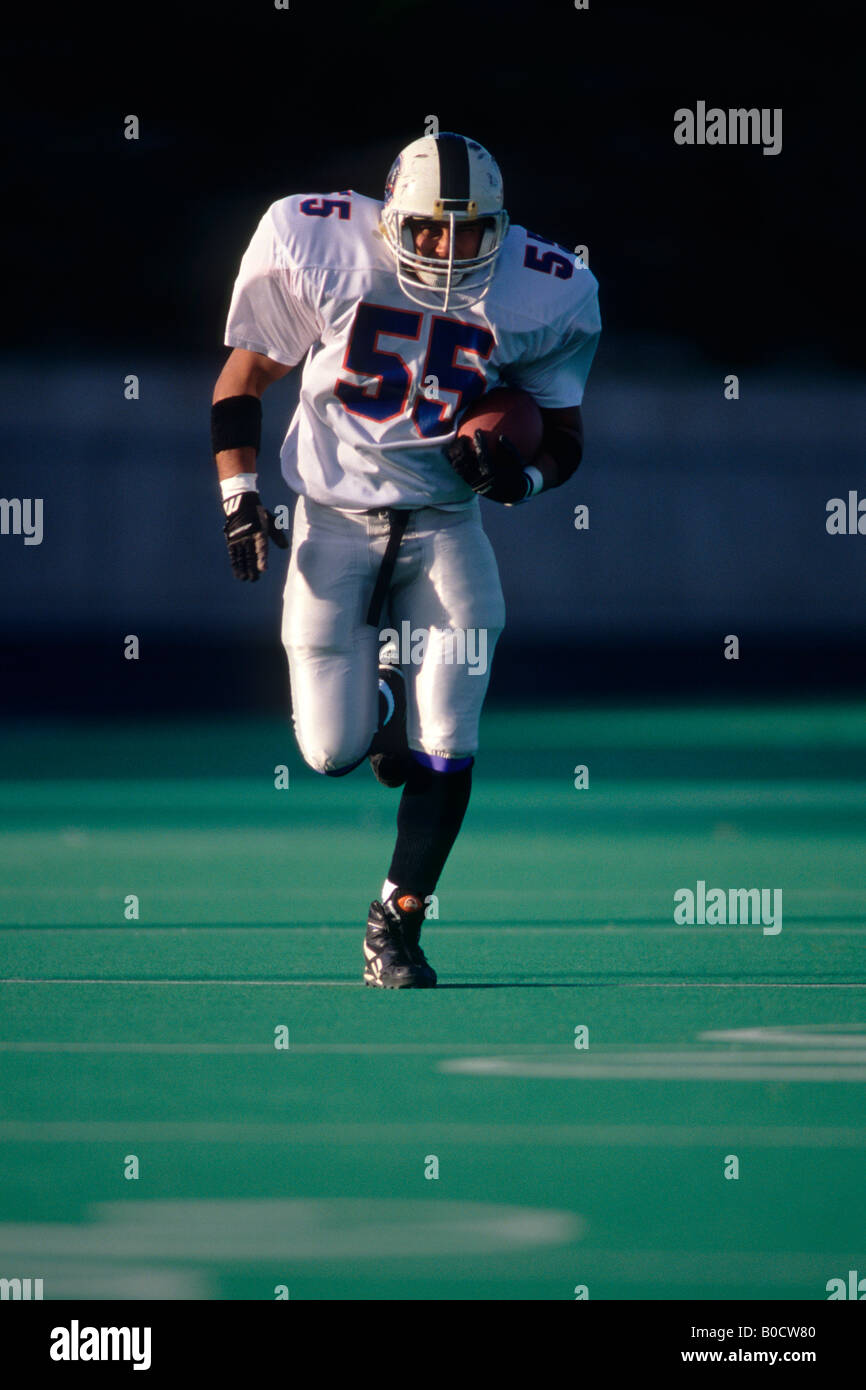 Football running back Stock Photo - Alamy