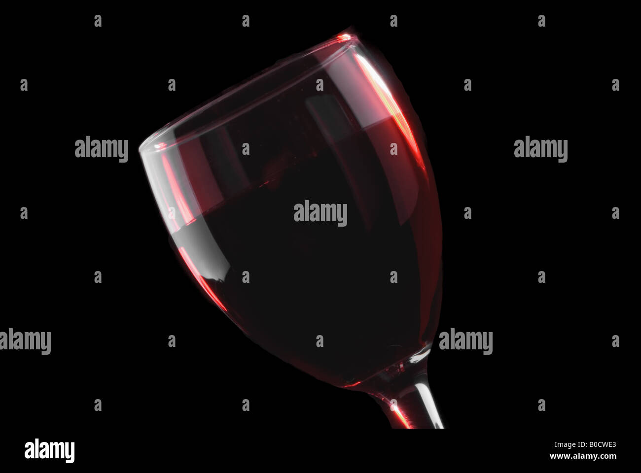 Low key red wine glass on a black background Stock Photo - Alamy