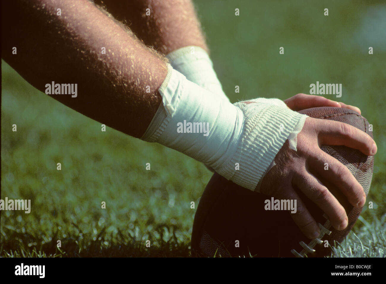 Football center about to snap the ball Stock Photo - Alamy