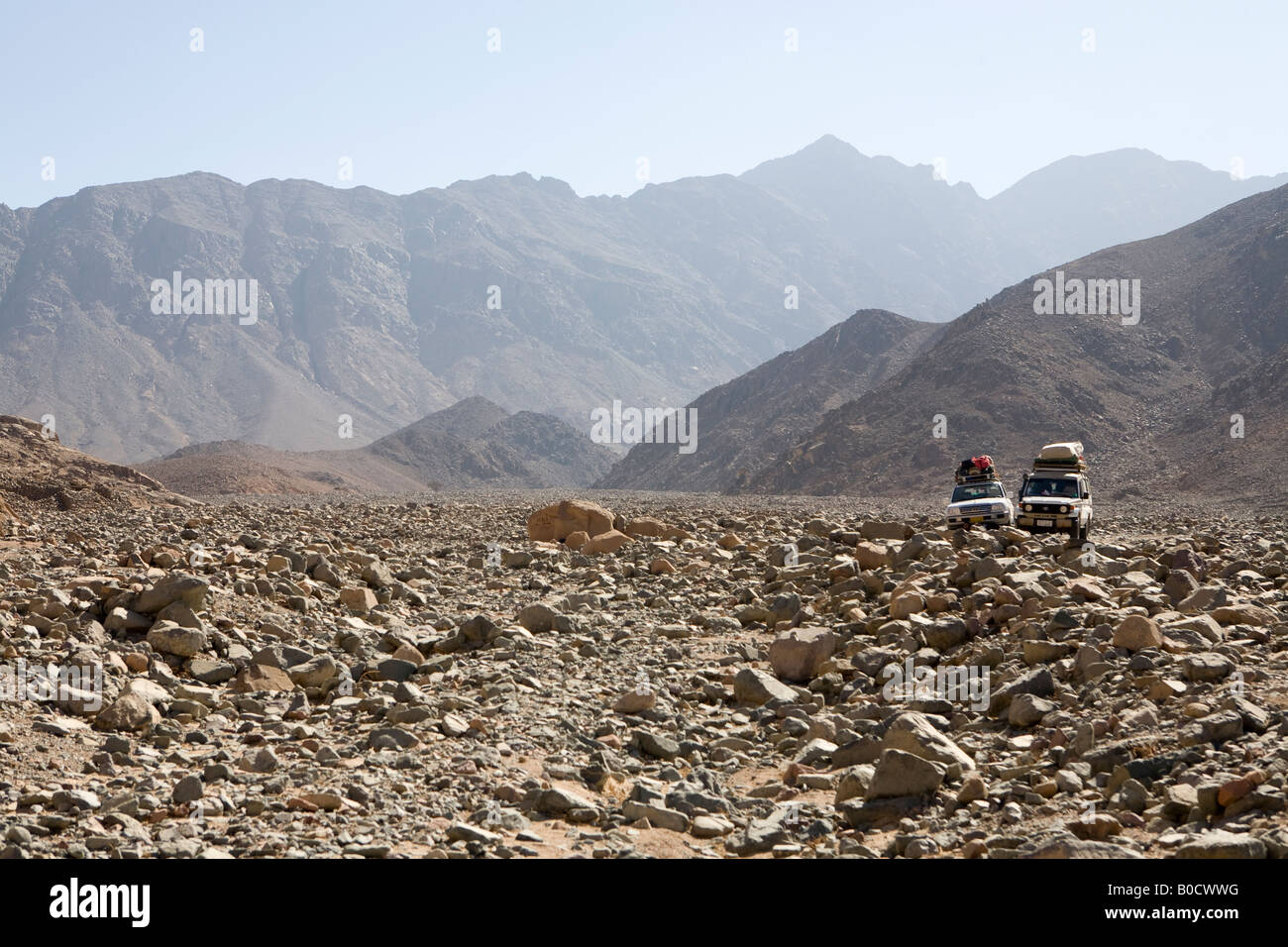 Vehicles driving in the wadi bed at Mons Porphyrites, Red Sea Hills ...