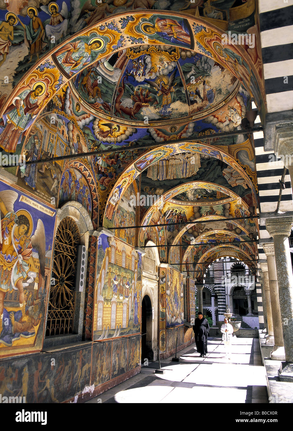 Monk walking down cloister at Rila Monastery Bulgaria Stock Photo - Alamy