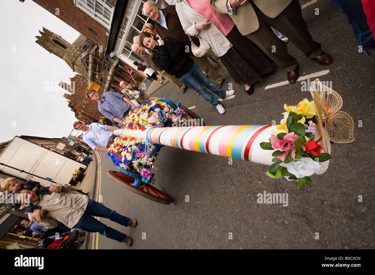 UK Cheshire Knutsford Royal May Day Procession men carrying symbolic ...