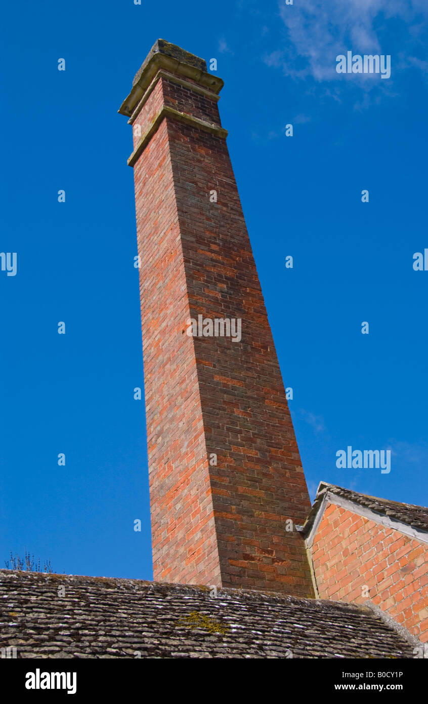 Brick chimney stack at Mill Museum on River Eye in Cotswold village of ...