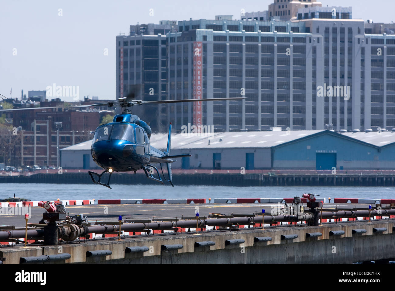 A commuter helicopter lands at the Manhattan heliport Stock Photo - Alamy