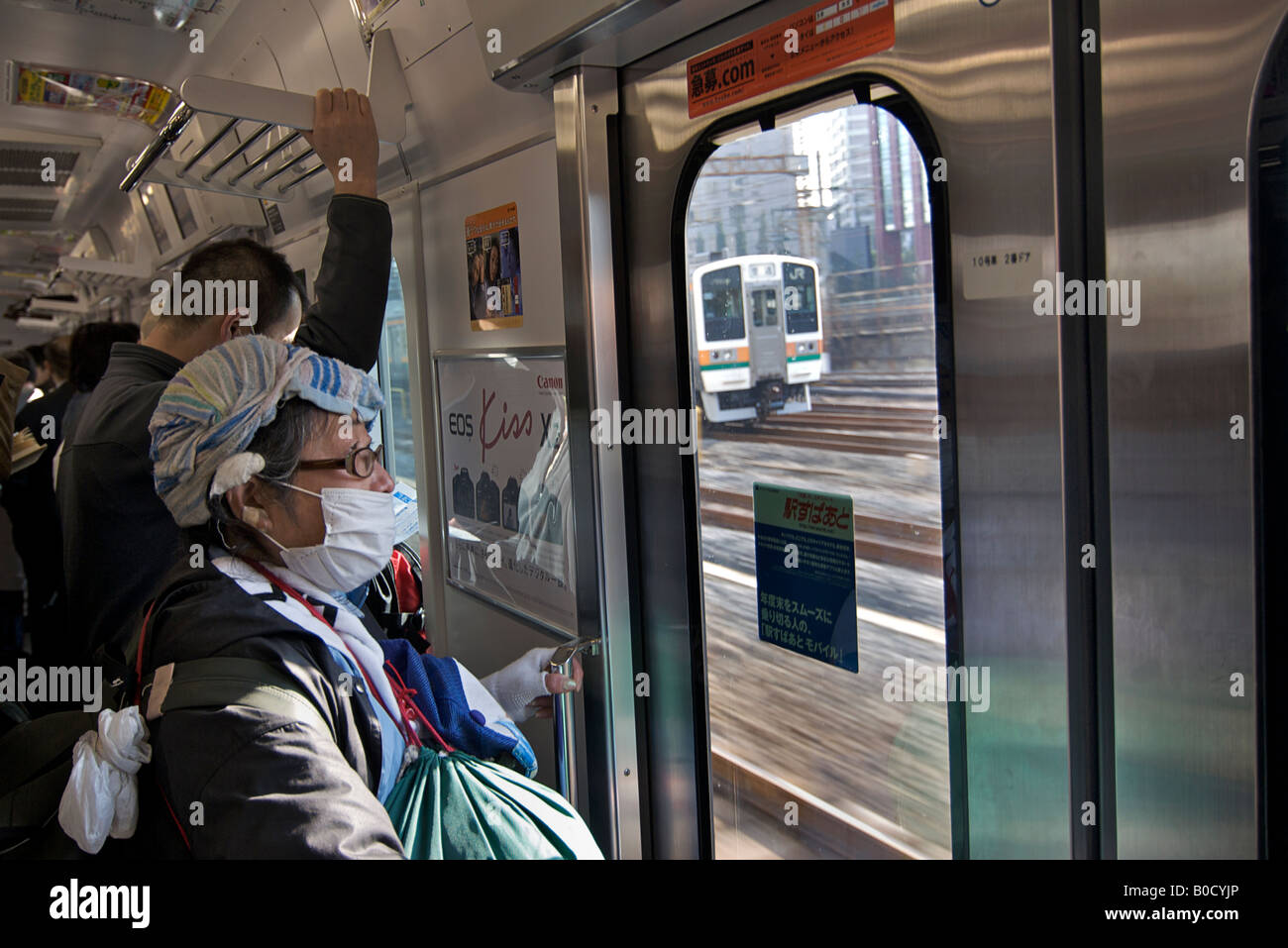 Japanese woman with face mask on the Japnese Metro, Tokyo, Japan Stock ...