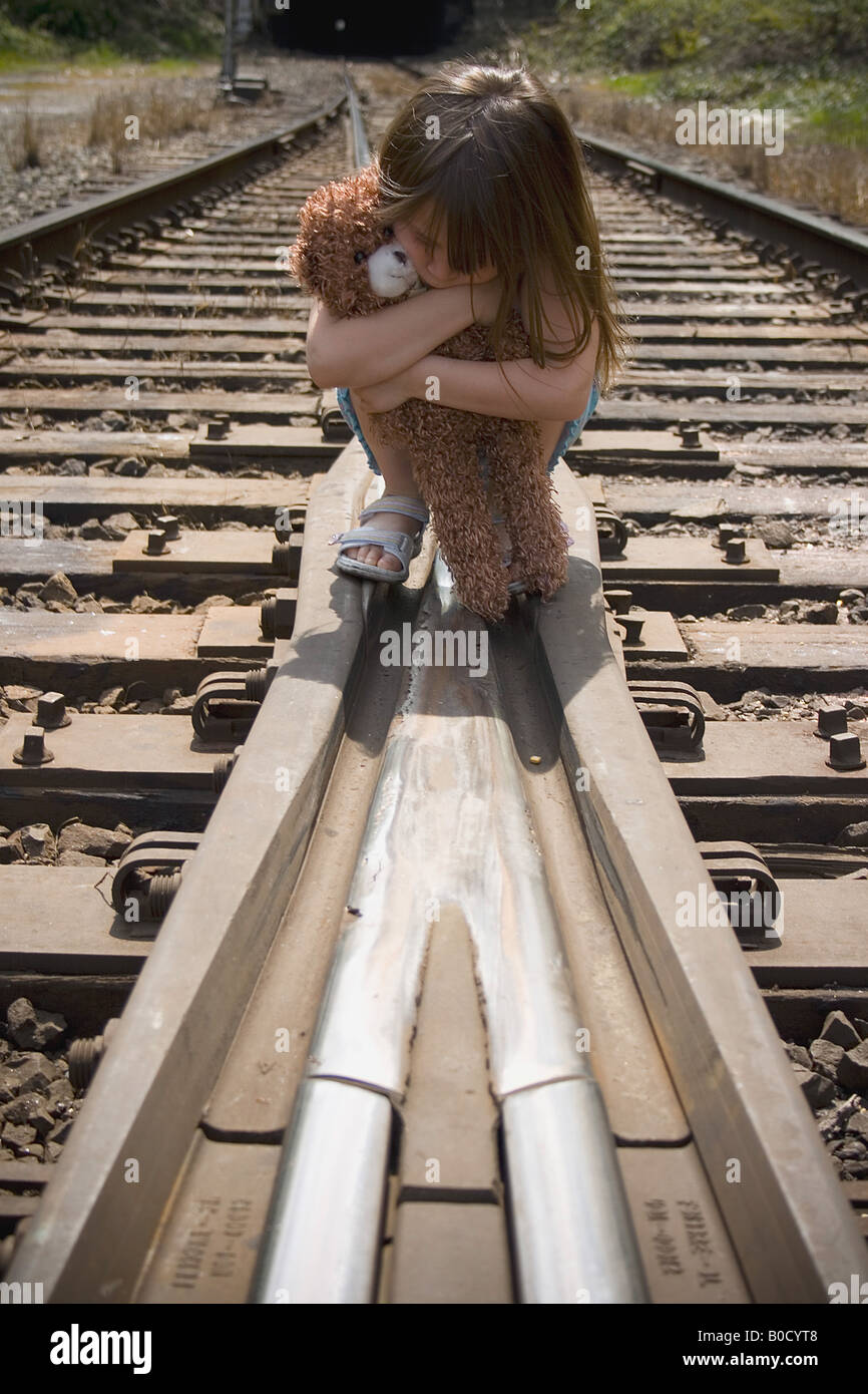 Crouching down sad hi-res stock photography and images - Alamy