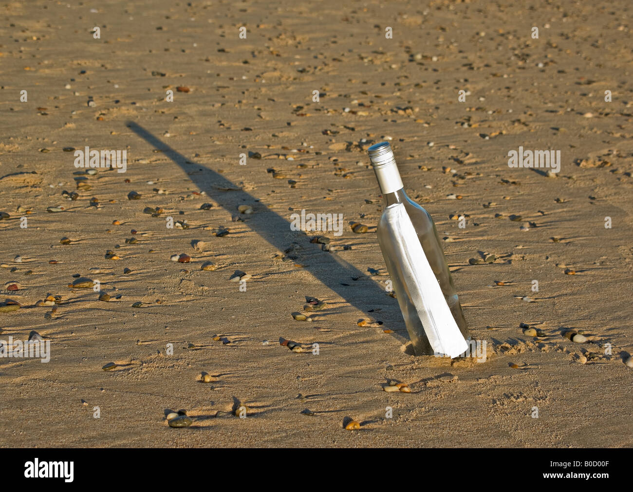message in a bottle on the beach sand Stock Photo - Alamy