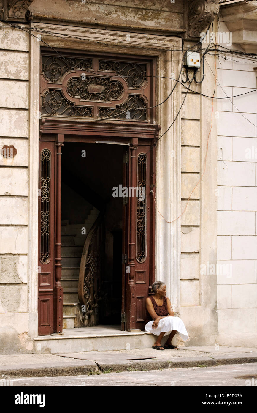Cuban sitting on doorstep to old house hi-res stock photography and ...