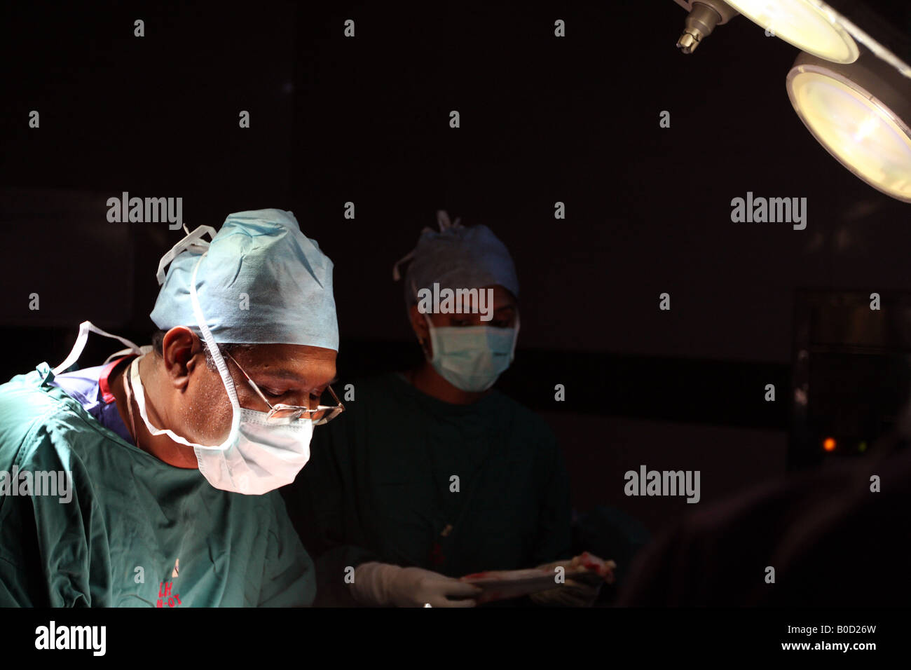Surgeon performing surgery in an operation theatre in India Stock Photo ...
