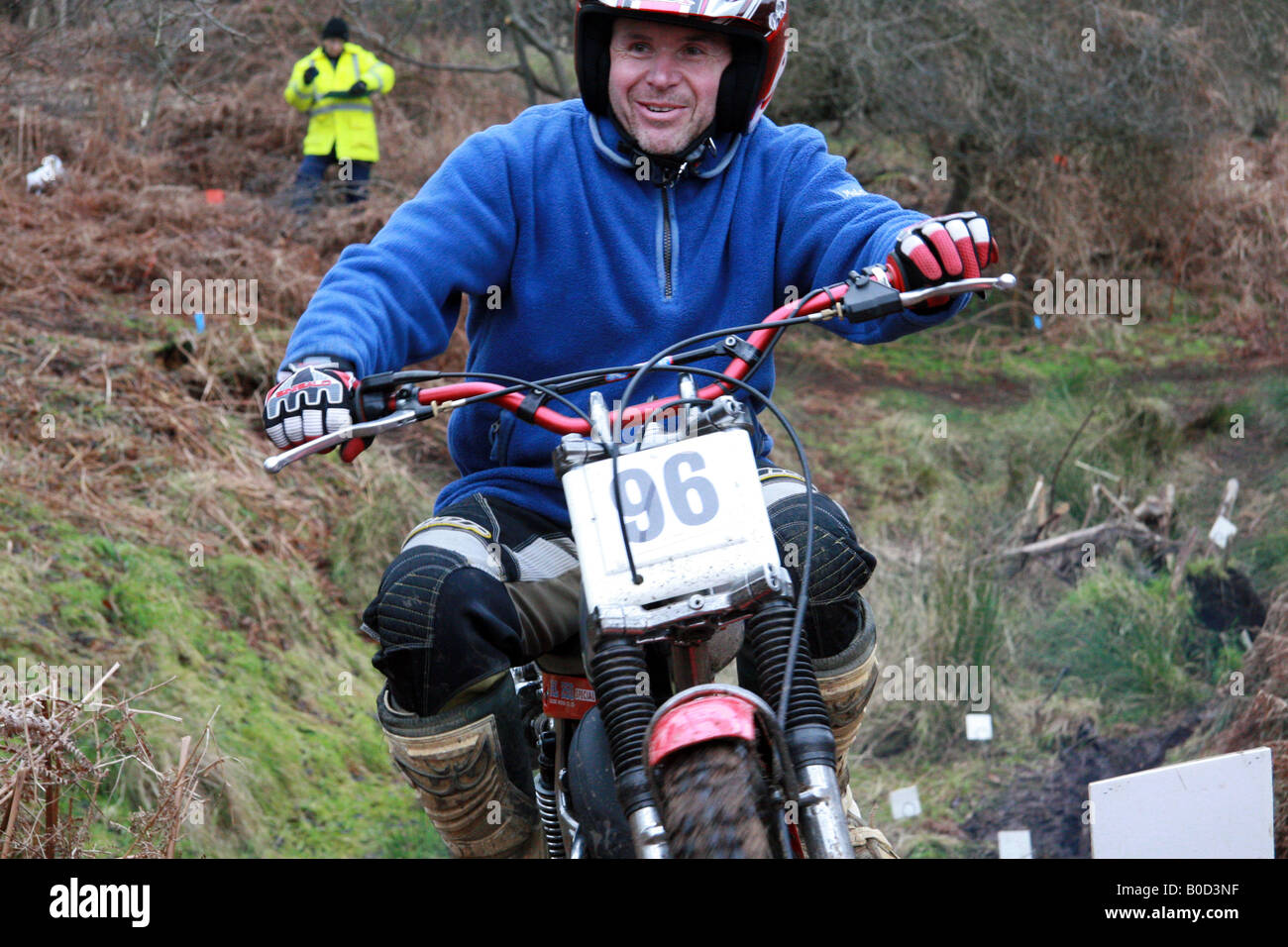 Happy looking motorcycle triallist at the top of a steep climb Stock ...