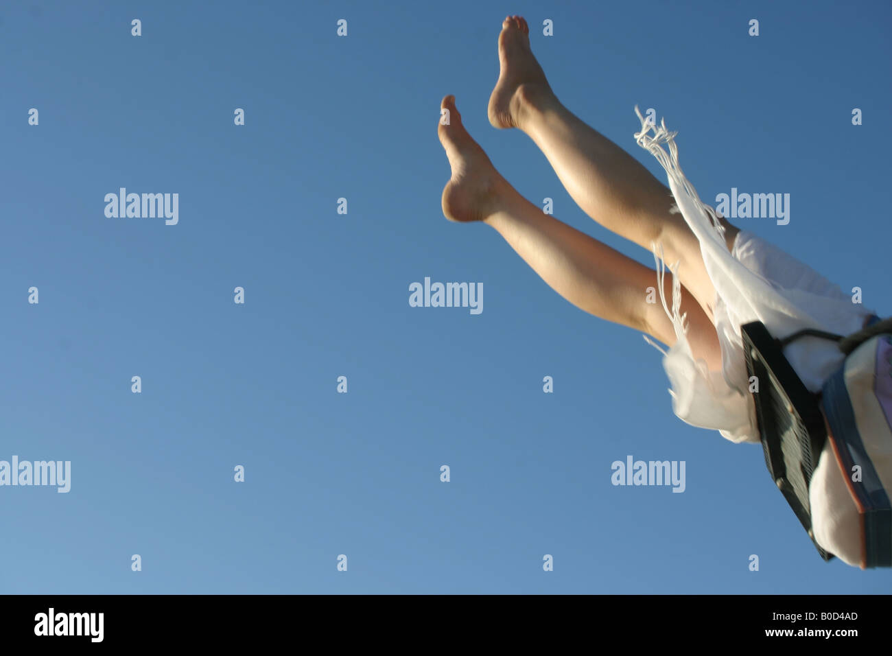 feeling free swinging high Stock Photo - Alamy