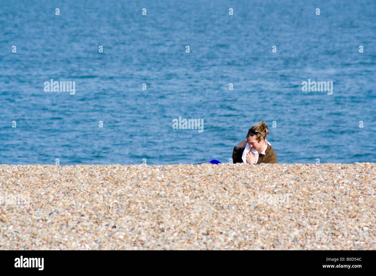 A woman's head and what looks like a blue bucket?! pops up above the ...