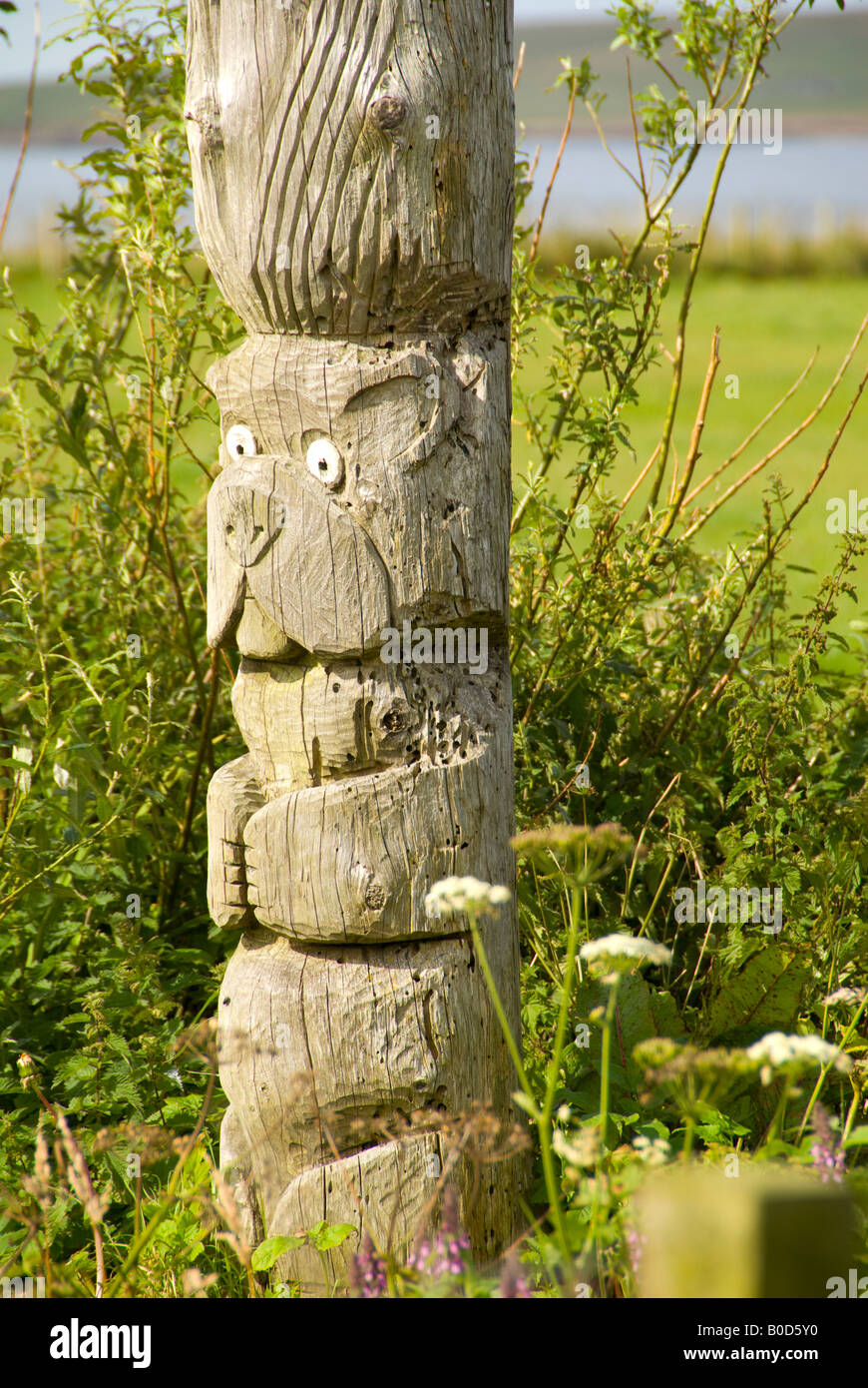 Detail from a Totem Pole in a garden at Evie, Mainland, Orkney Islands ...