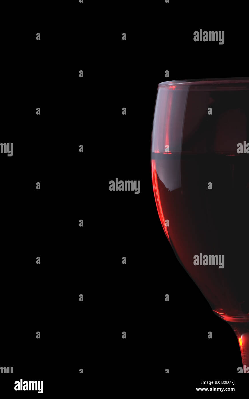 Low key red wine glass on a black background Stock Photo - Alamy