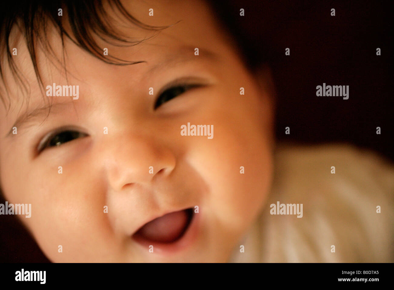 Two month old baby girl laughing Stock Photo - Alamy