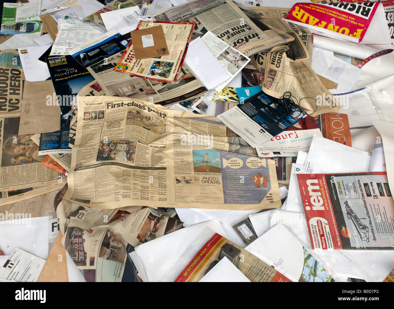 Unwanted mail piling up behind the front door of a shop that has closed ...