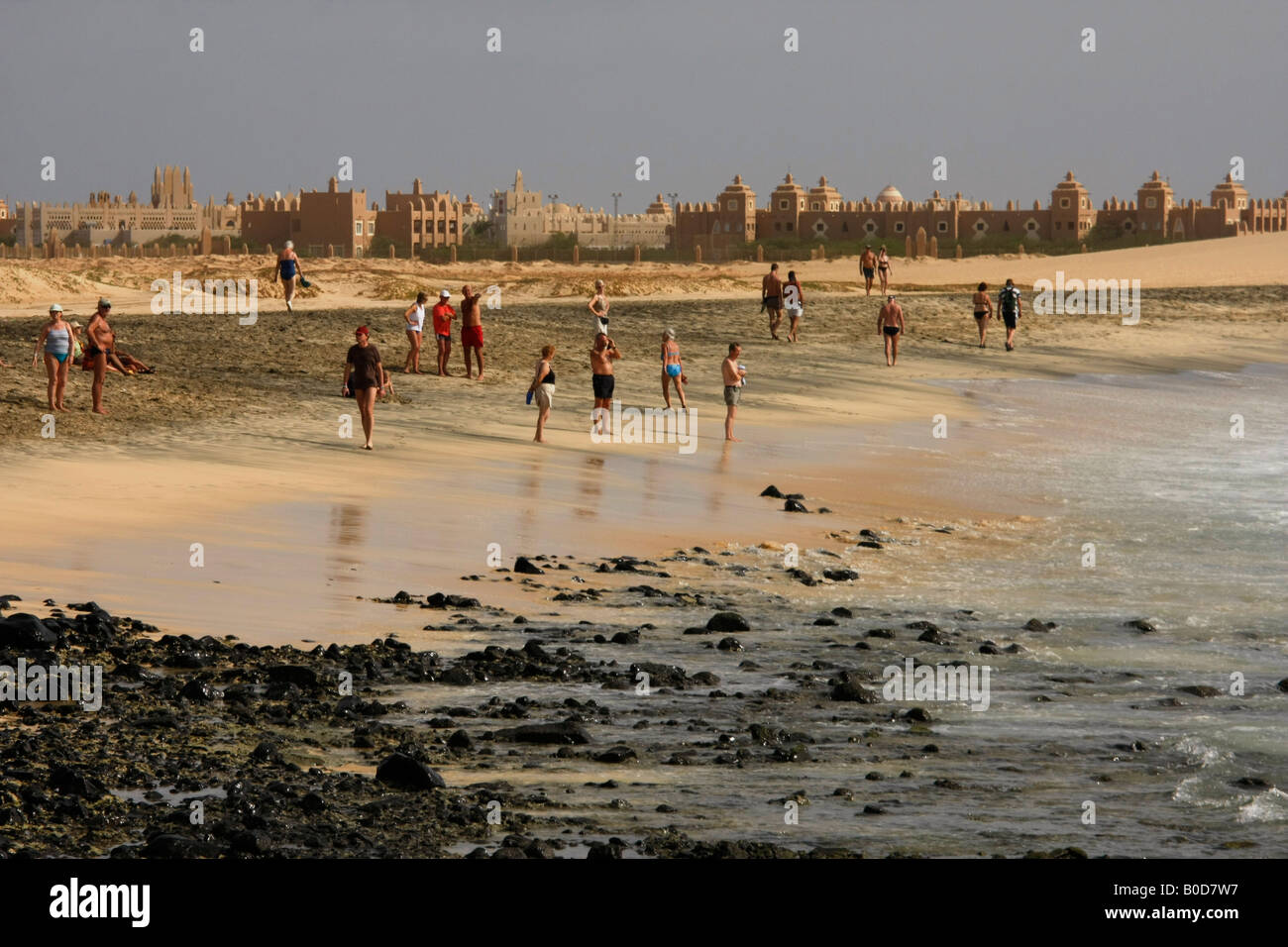 tourists at the beach in front of the giant Riu Funana Garopa hotels ...