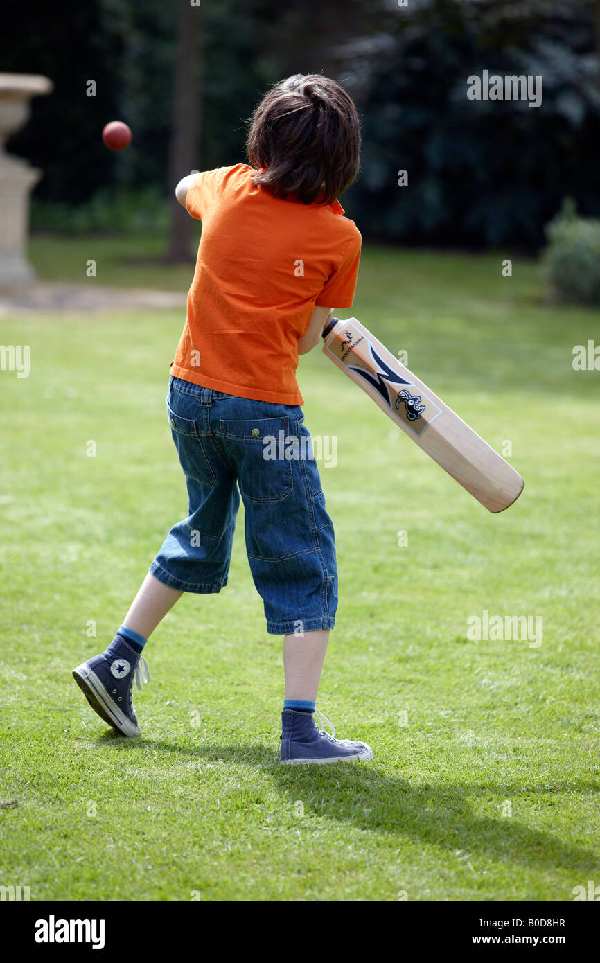 Young schoolboy, playing cricket Stock Photo - Alamy