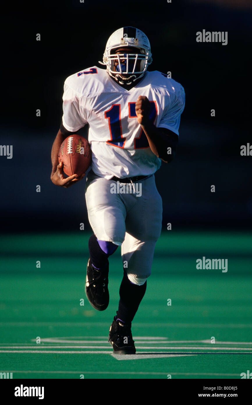 Football running back in action Stock Photo - Alamy